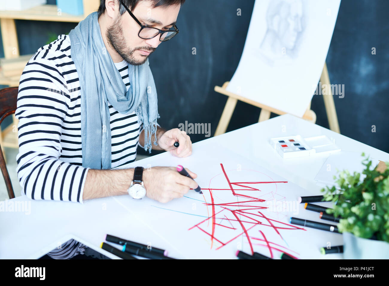 Creative man drawing with markers Stock Photo - Alamy