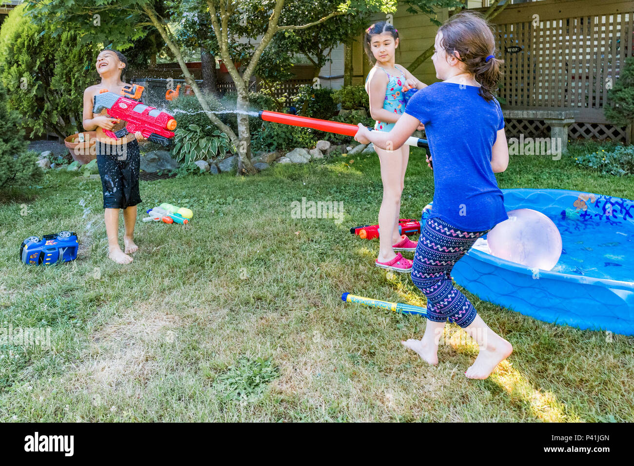 Pool water water fight hi-res stock photography and images - Alamy