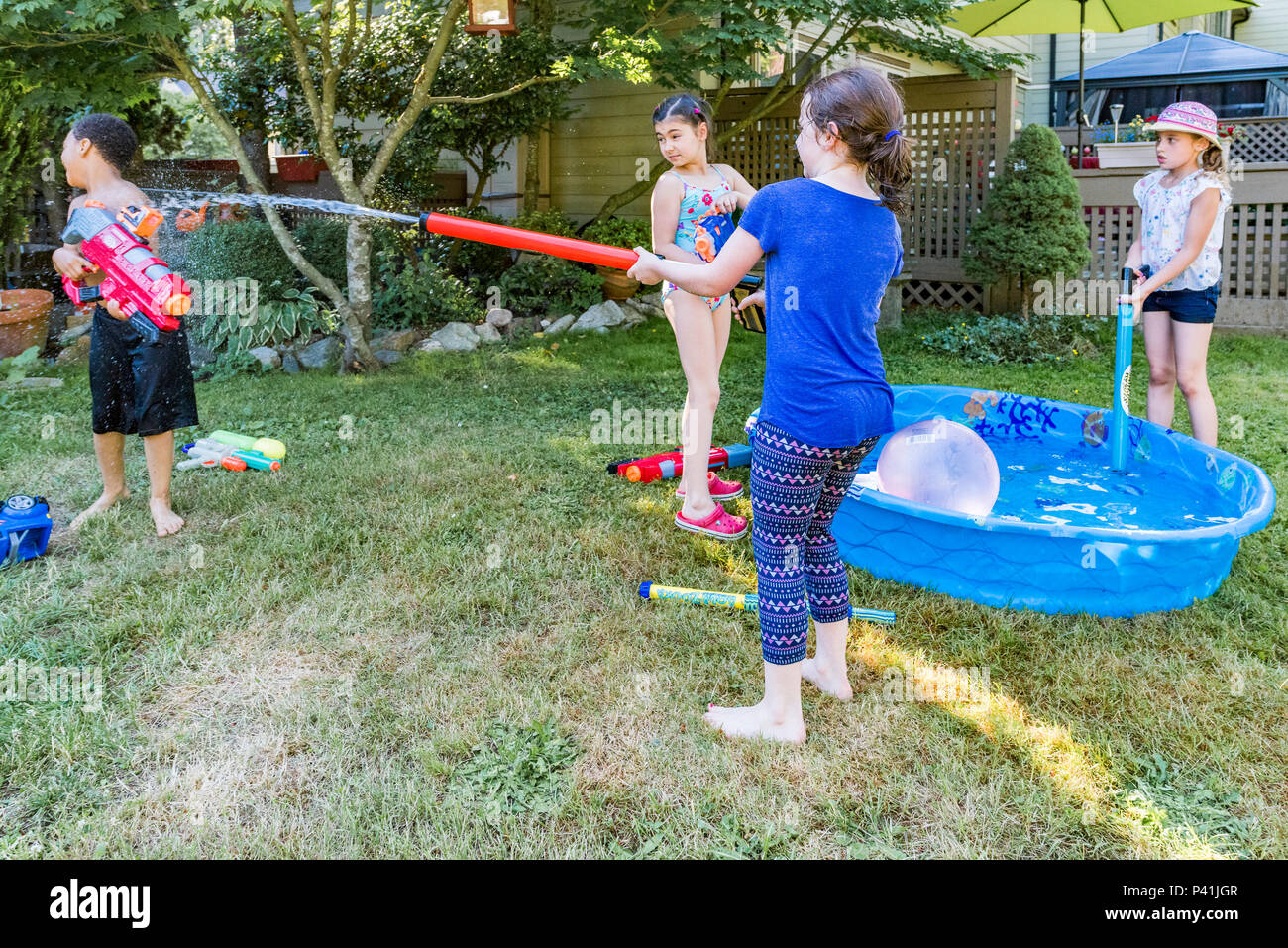 Pool water water fight hi-res stock photography and images - Alamy