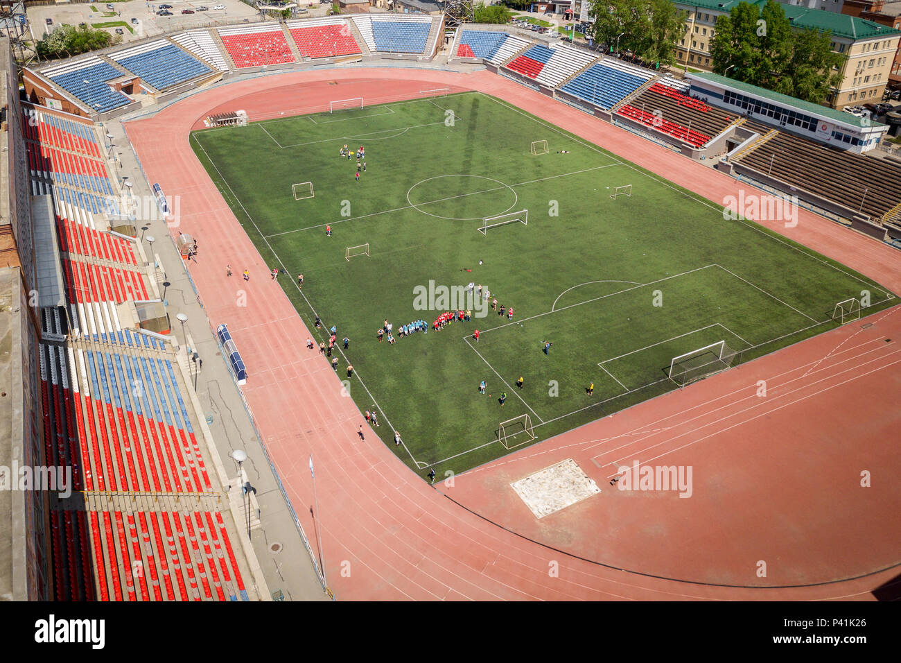 Aerial photography of a modern stadium with green field for football, a ...