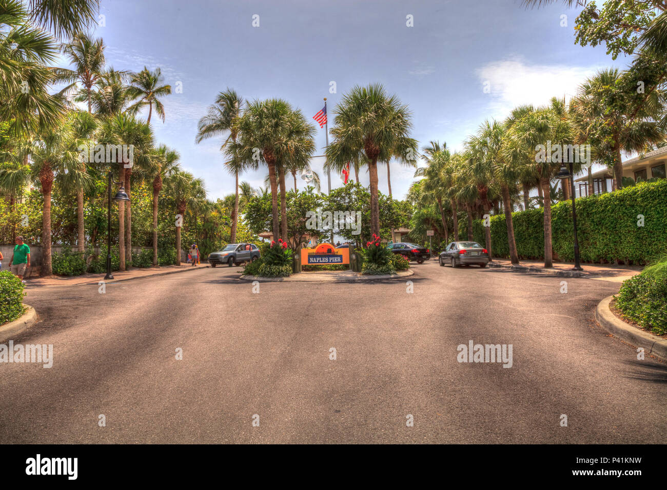 Entrance of the Naples Pier with tropical flowers in the summer in ...