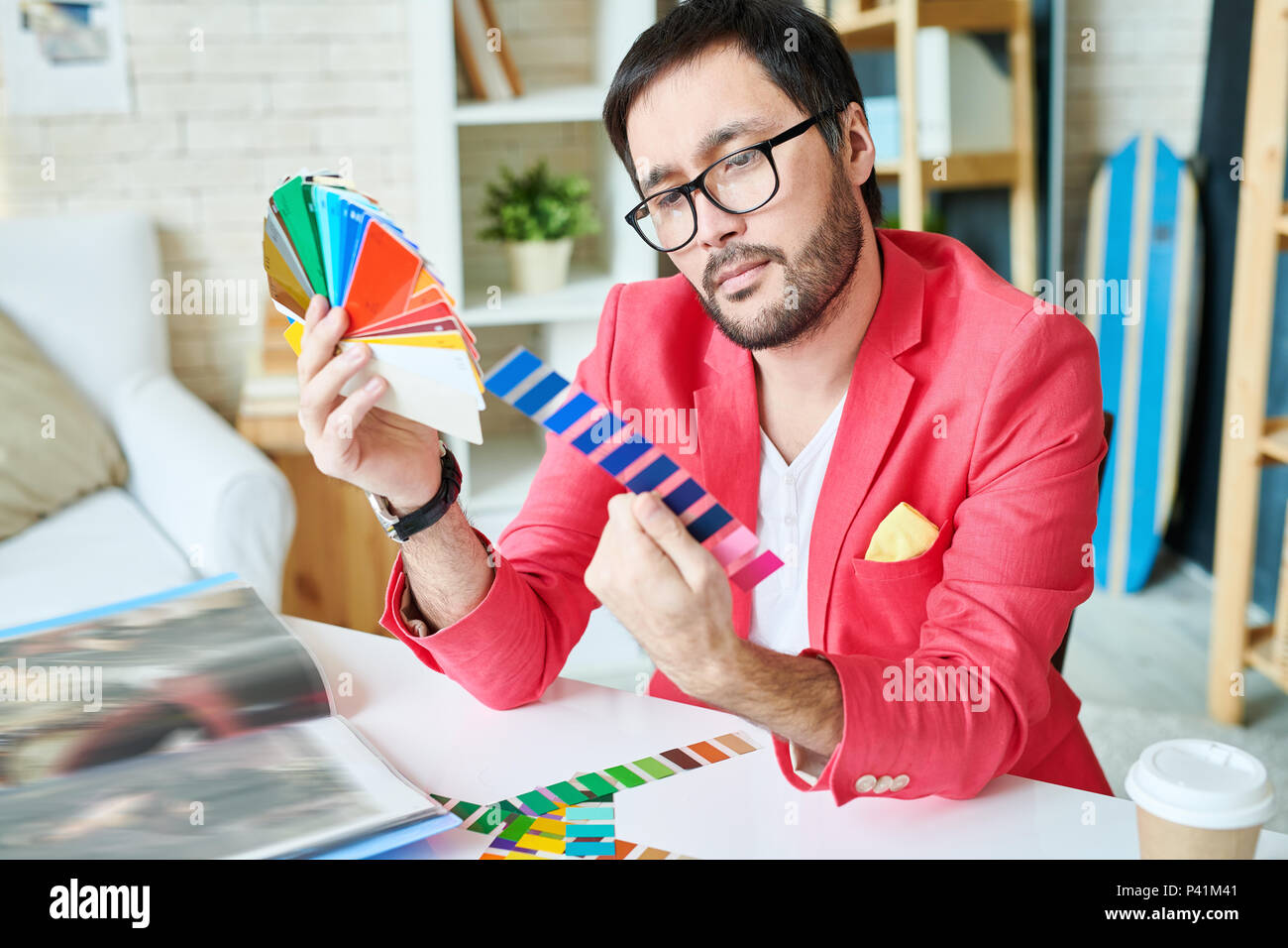 Pensive stylish choosing new line colors Stock Photo - Alamy