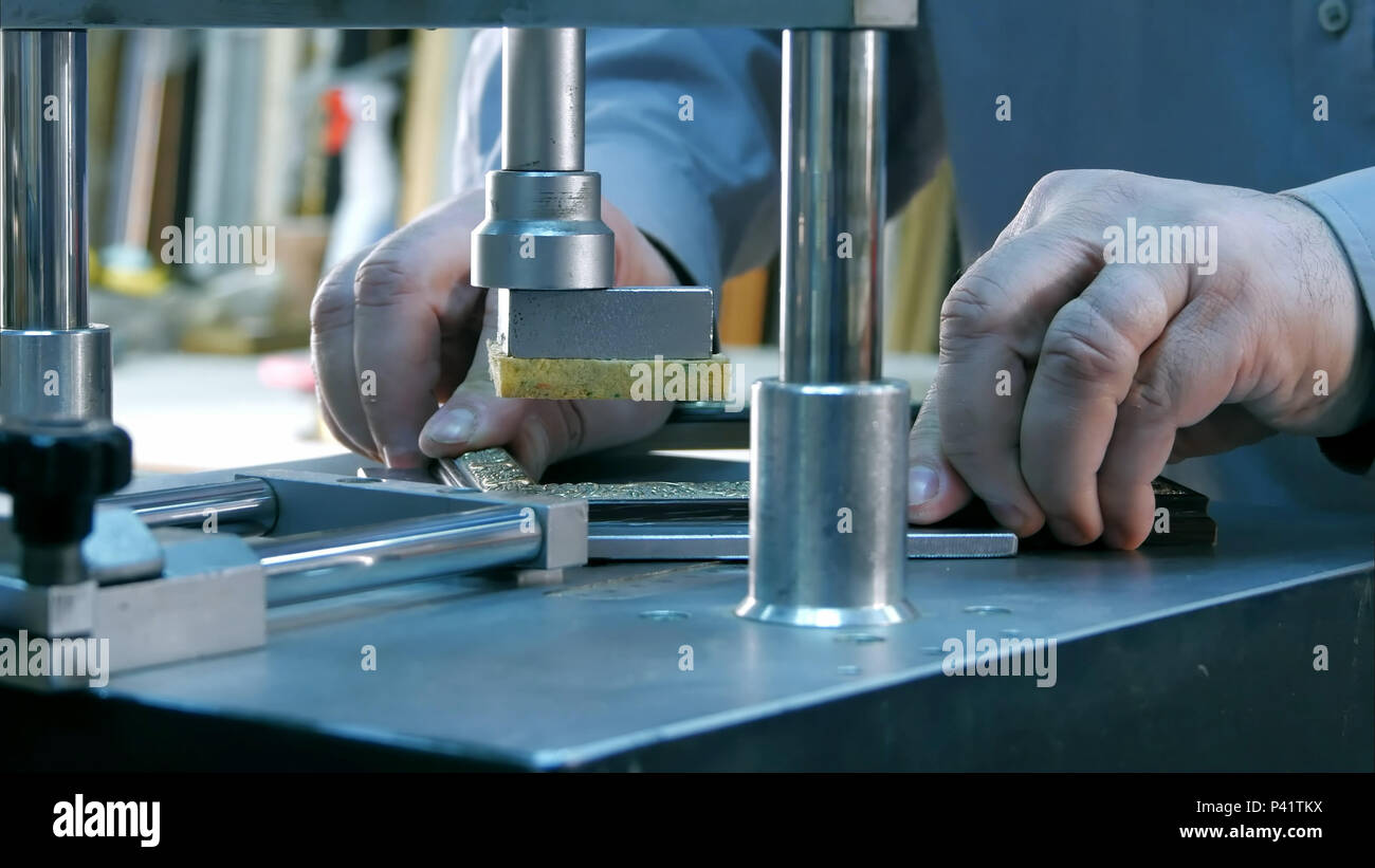 Professional framer hand holding frame angle, working on machine Stock ...