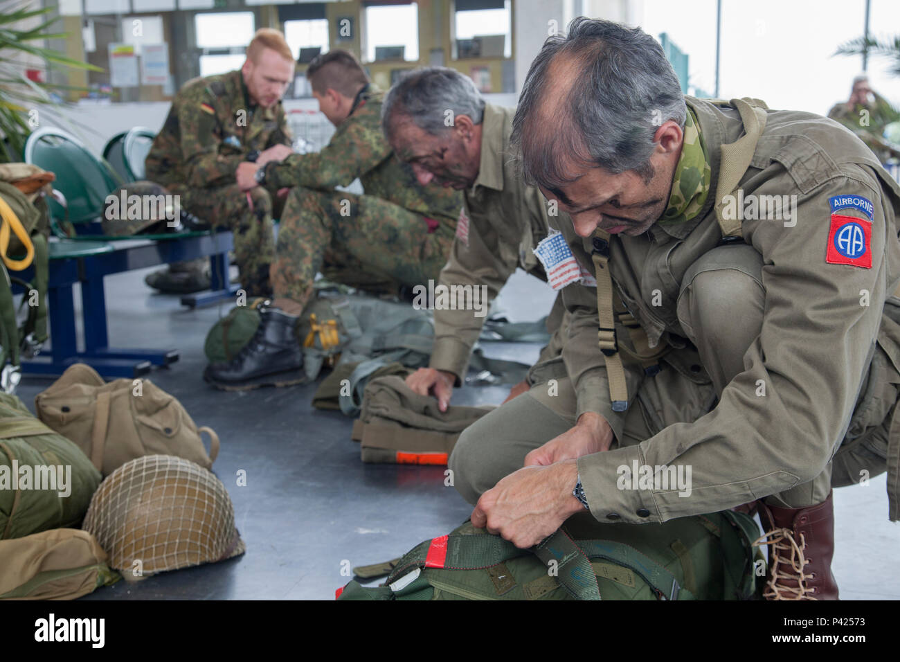 Members of the Round Canopy Parachuting Team, and paratroopers from the ...
