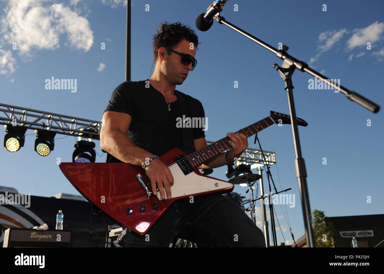 Andy Skib, guitarist for David Cook, plays guitar during a free concert ...