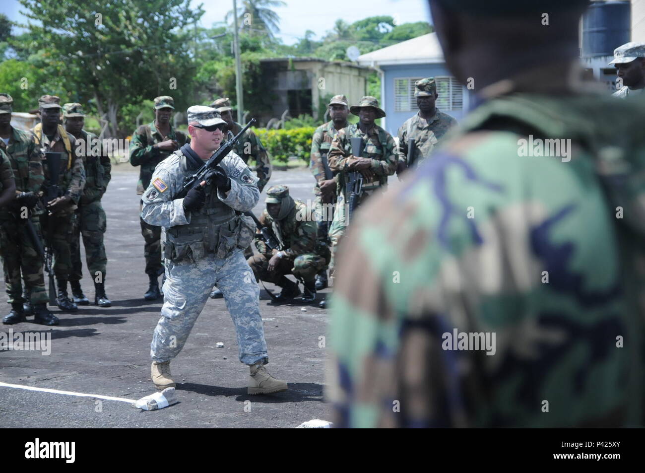 Sgt. 1st Class Curt Kinker instructs members of the Grenada Special ...