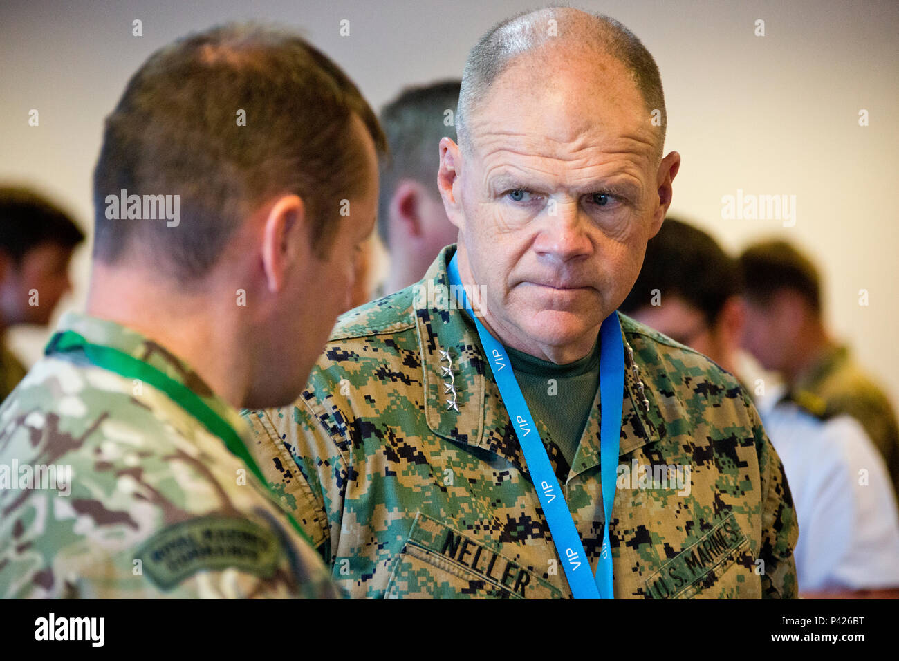 Commandant of the Marine Corps, Gen. Robert B. Neller, listens to a ...