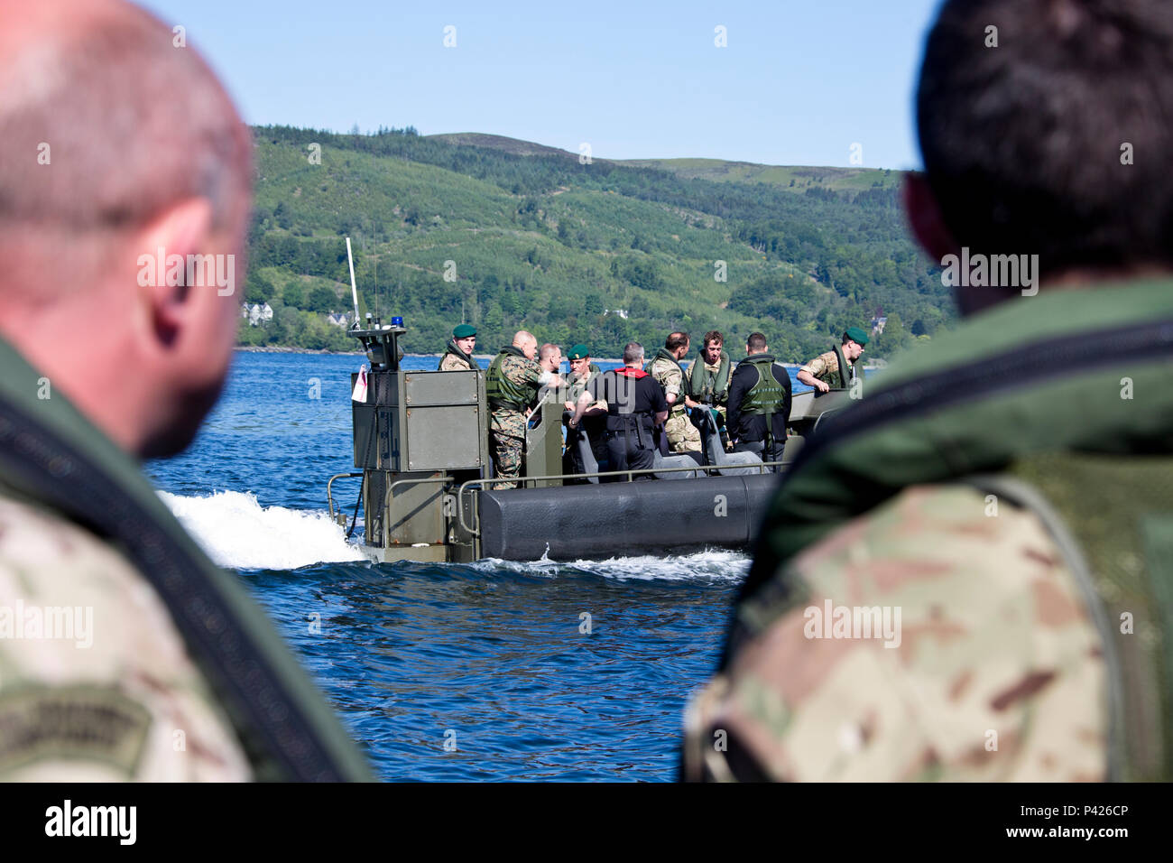 Royal Marines watch the Commandant of the Marine Corps, Gen. Robert B ...