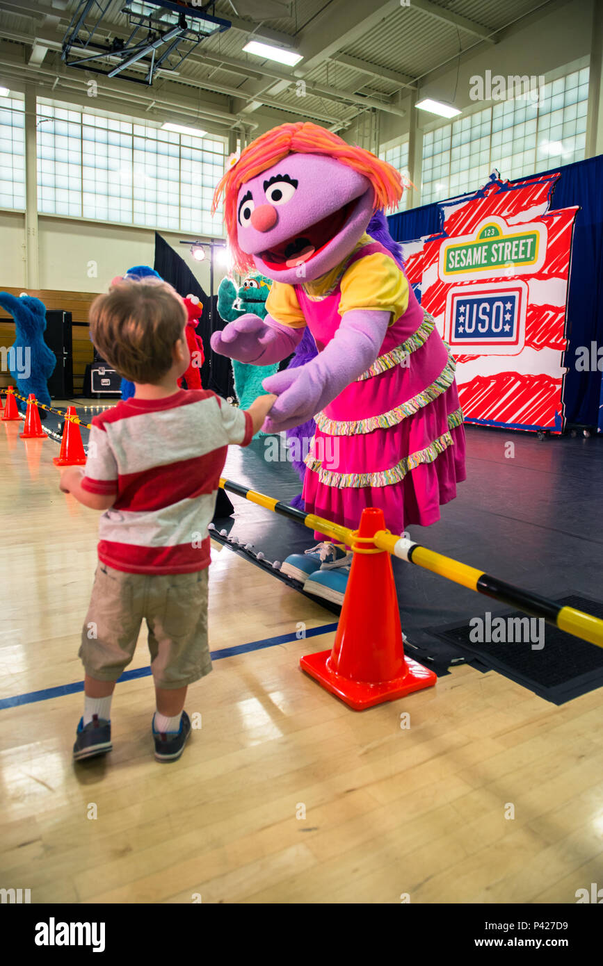 The son of U.S. Air Force Senior Master Sgt. Matthew Grelck shakes hand ...