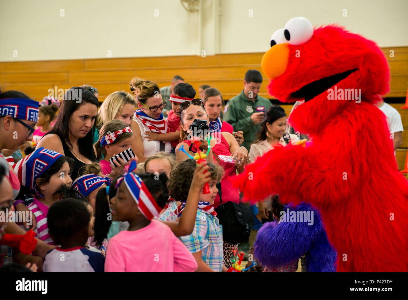 Sesame Street character Elmo shakes hands with the audience at the ...