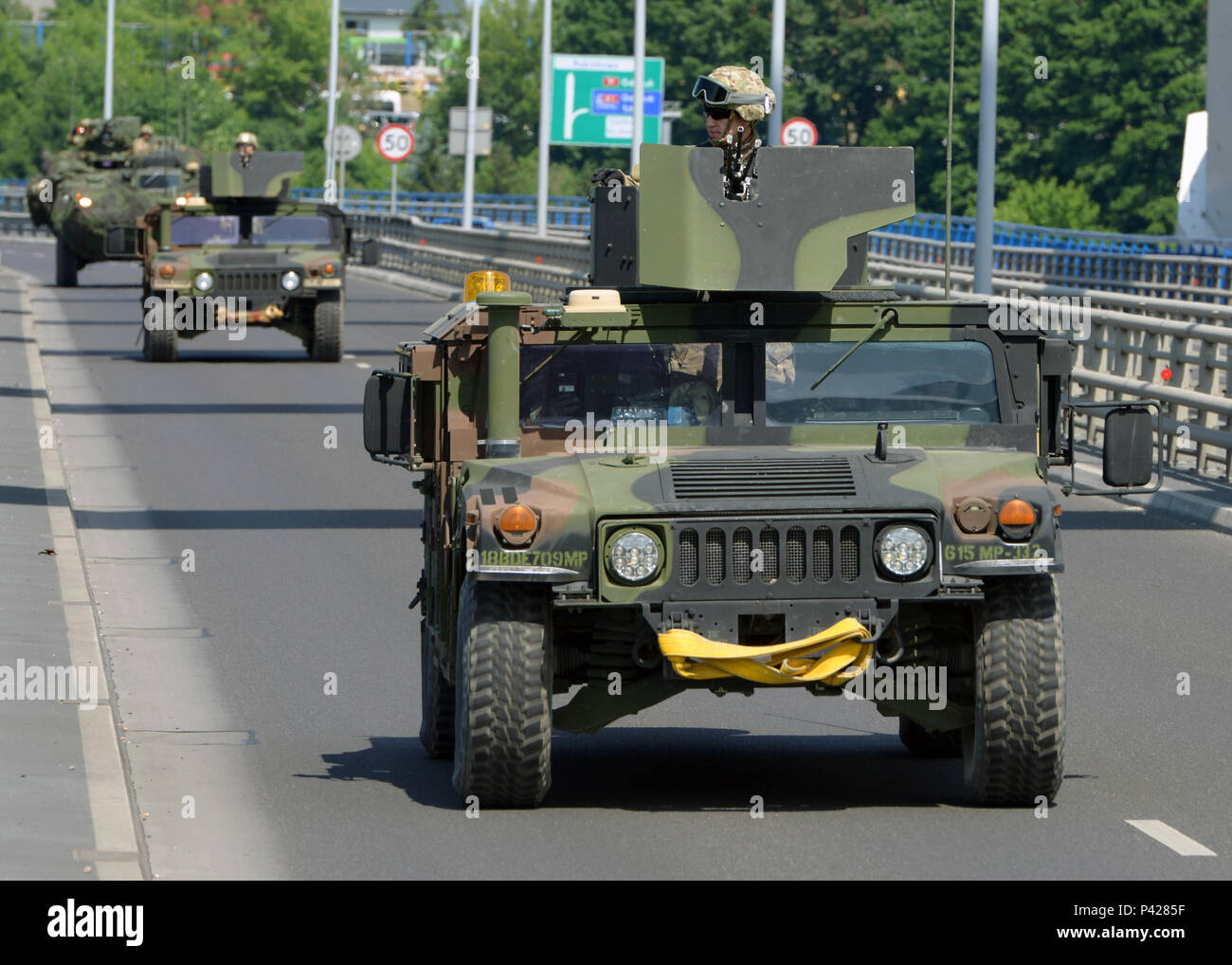 Military tactical vehicles prepare to engage their target during ...