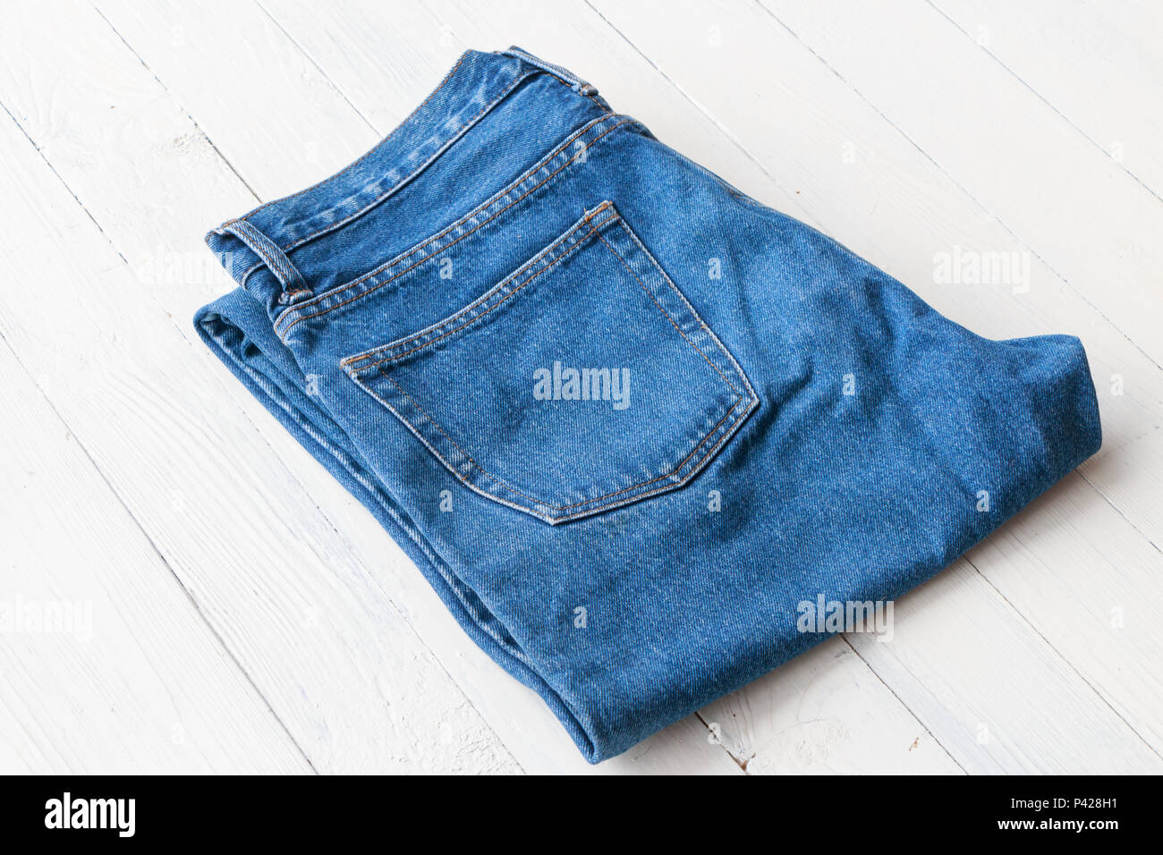 Folded denim on floor hi-res stock photography and images - Alamy