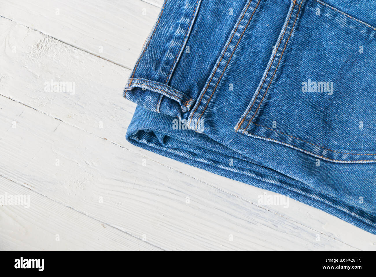 Folded denim on floor hi-res stock photography and images - Alamy