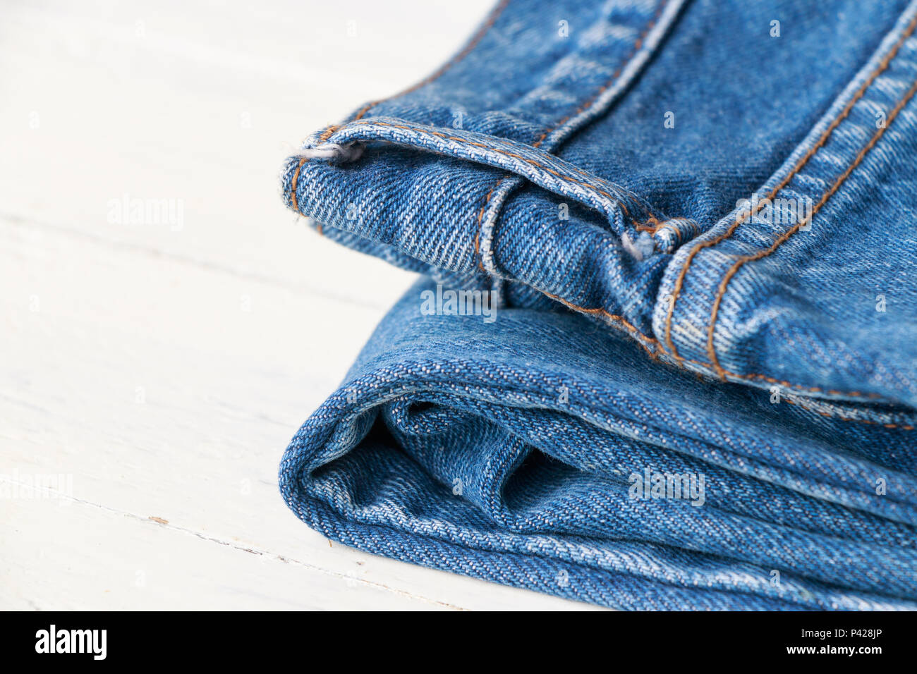 Folded denim on floor hi-res stock photography and images - Alamy