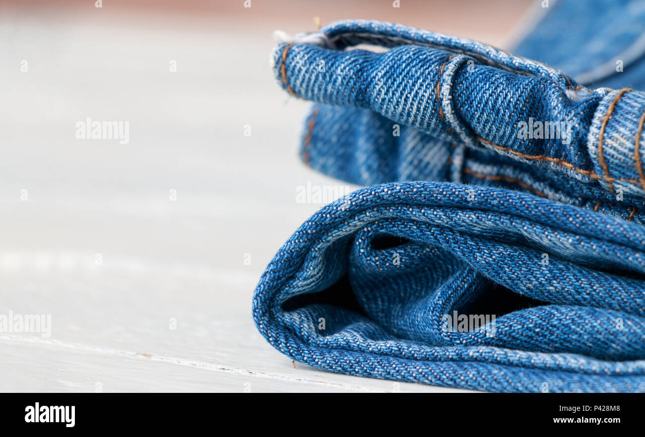 Folded denim on floor hi-res stock photography and images - Alamy