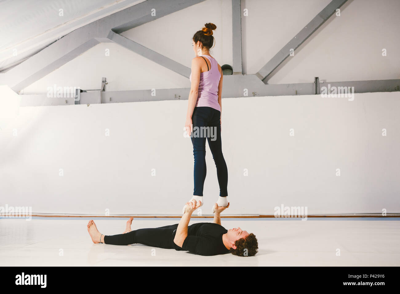 Yoga pose hand holding foot hi-res stock photography and images - Alamy