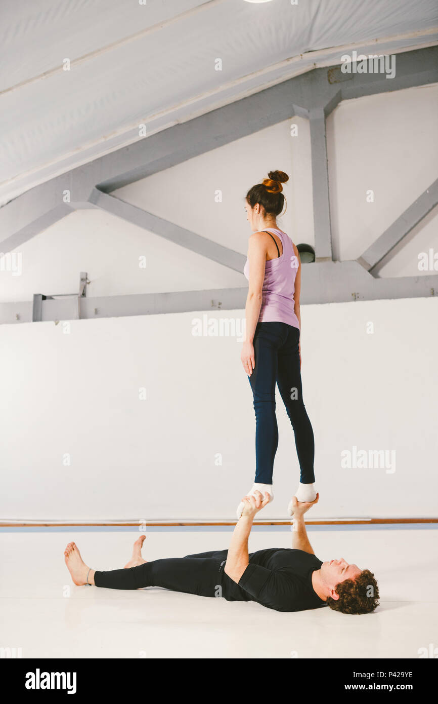 Yoga pose hand holding foot hi-res stock photography and images - Alamy