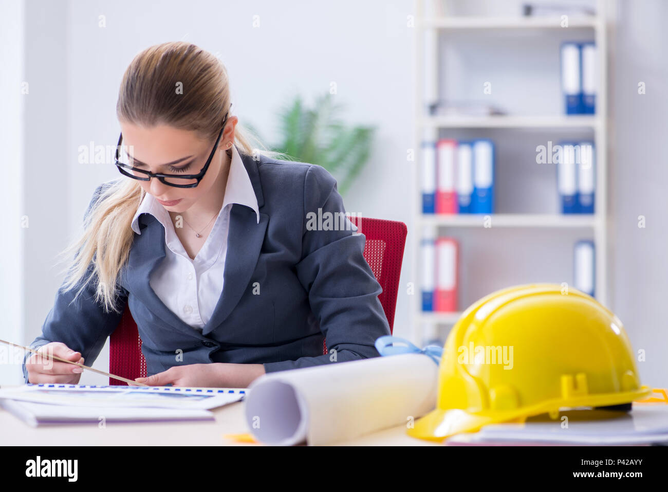 Woman architect working on the project Stock Photo - Alamy