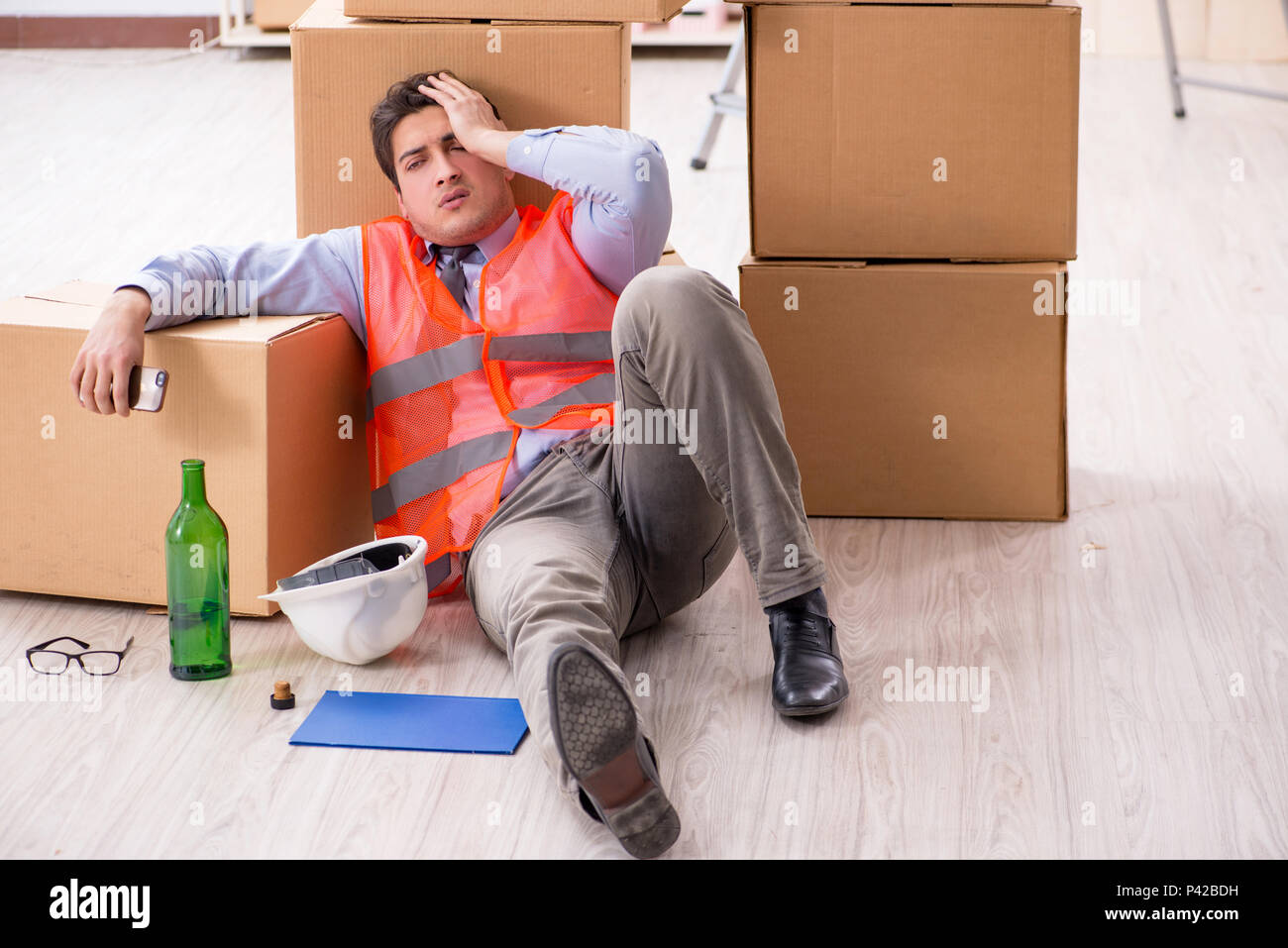 Delivery man drunk at work Stock Photo - Alamy