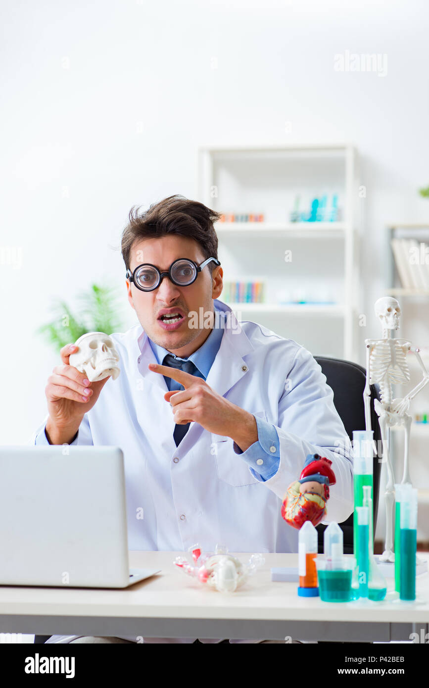 Funny doctor having fun in hospital lab Stock Photo - Alamy