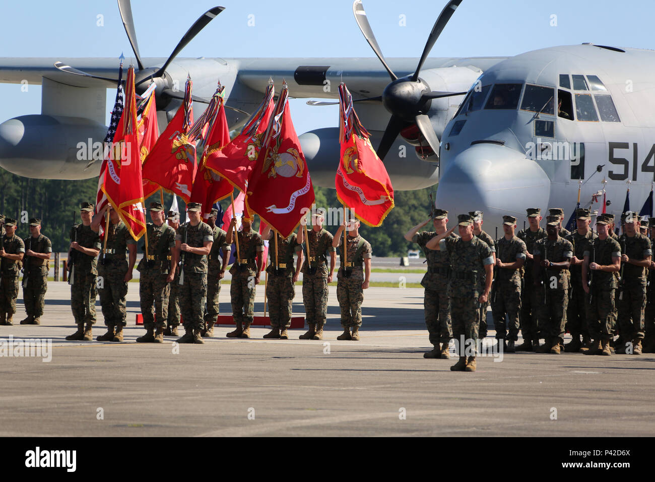 2nd Marine Aircraft Wing Marines salute the colors while the National ...