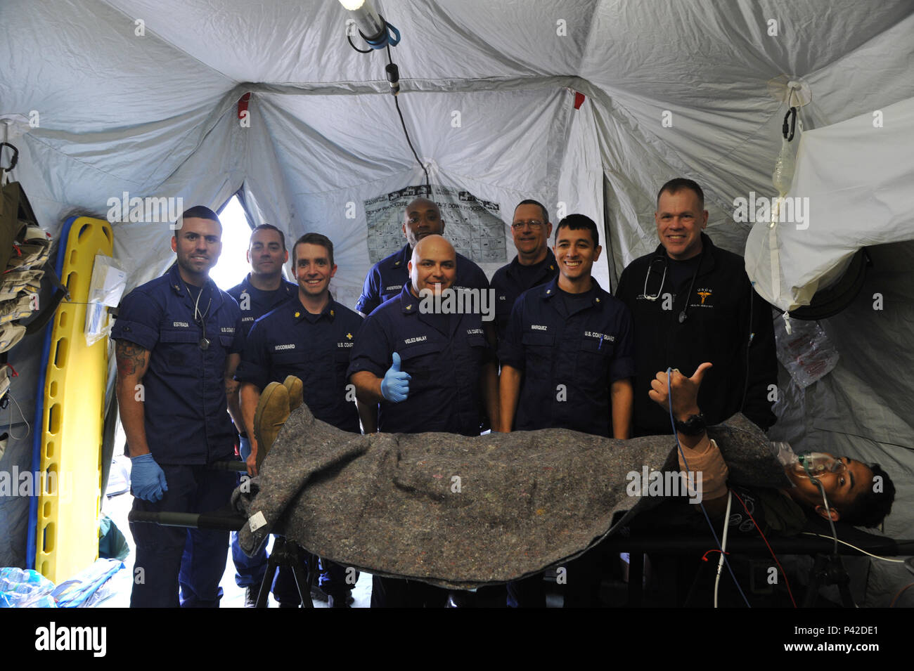Members of the Coast Guard mobile medical unit West participate in a ...