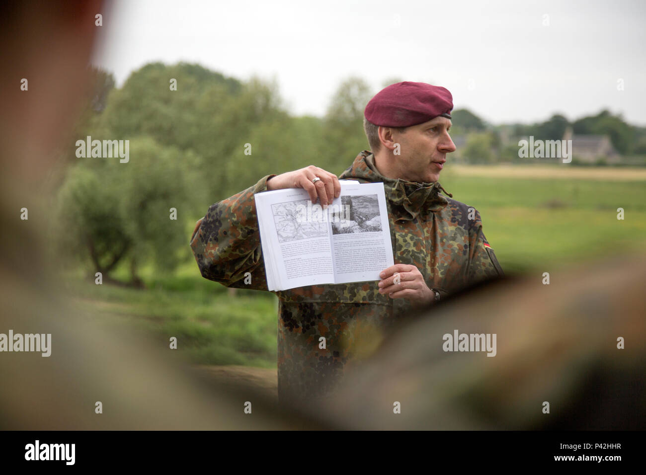 U.S. Army and German paratroopers visit the Iron Mike Memorial together ...