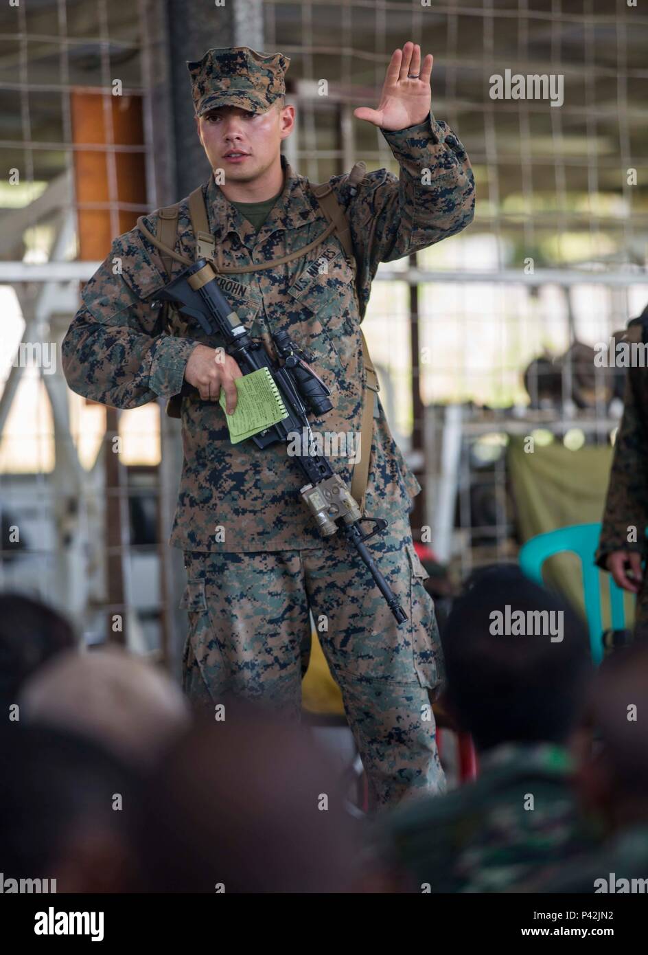 U.S. Marine Cpl. Ryan R Krohn, with Task Force Koa Moana, trains both U ...