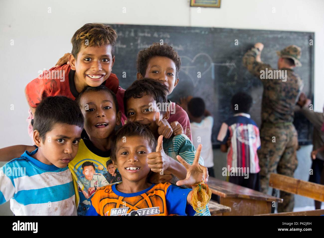 Timorese children pose for a photo at Metinaro Primary School during ...