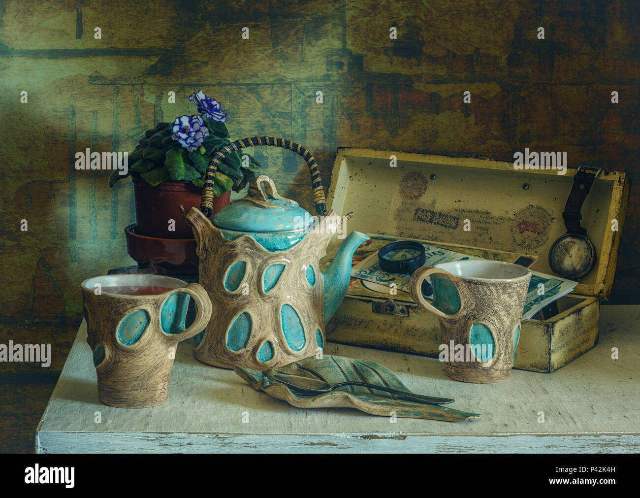 still life with handmade dishes, violet and a box. ceramics. vintage ...