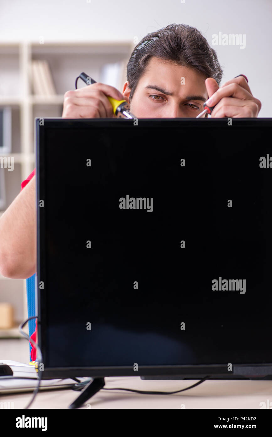 Professional repair engineer repairing broken tv Stock Photo - Alamy