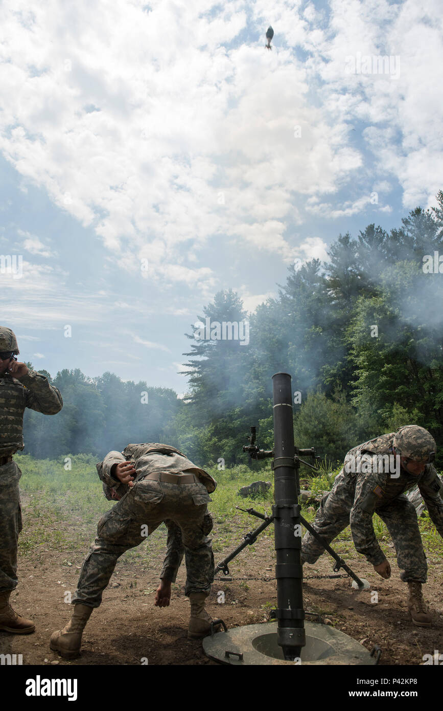 U.S. Army Spc. Doug Richardson (left) plugs his ears, while Spc. Craig ...