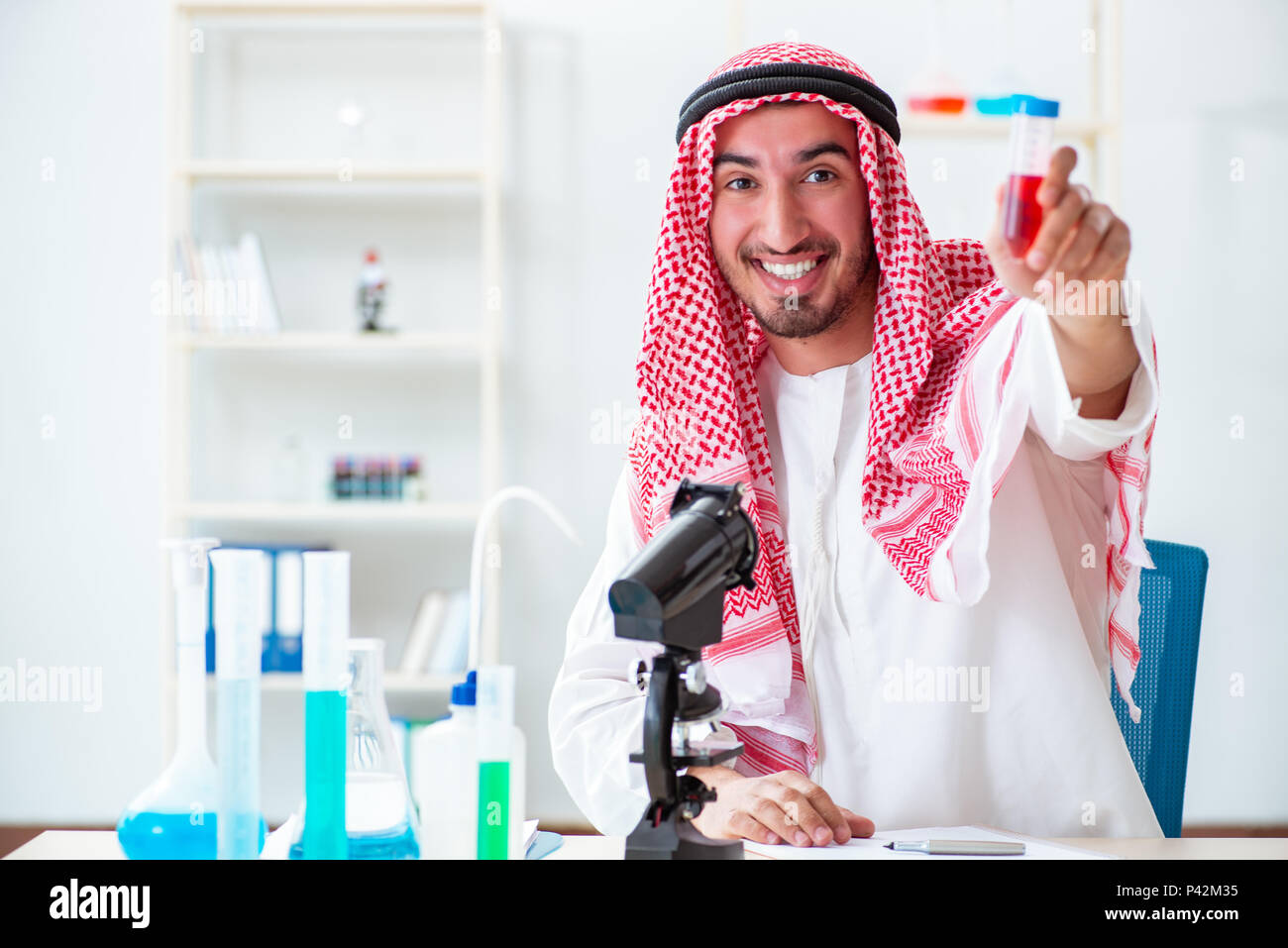 Arab chemist working in the lab office Stock Photo - Alamy