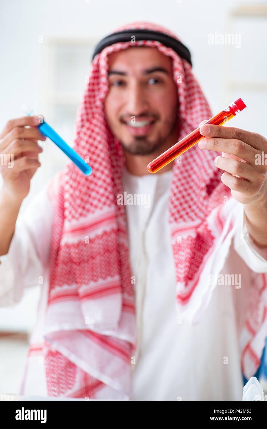 Arab chemist working in the lab office Stock Photo - Alamy