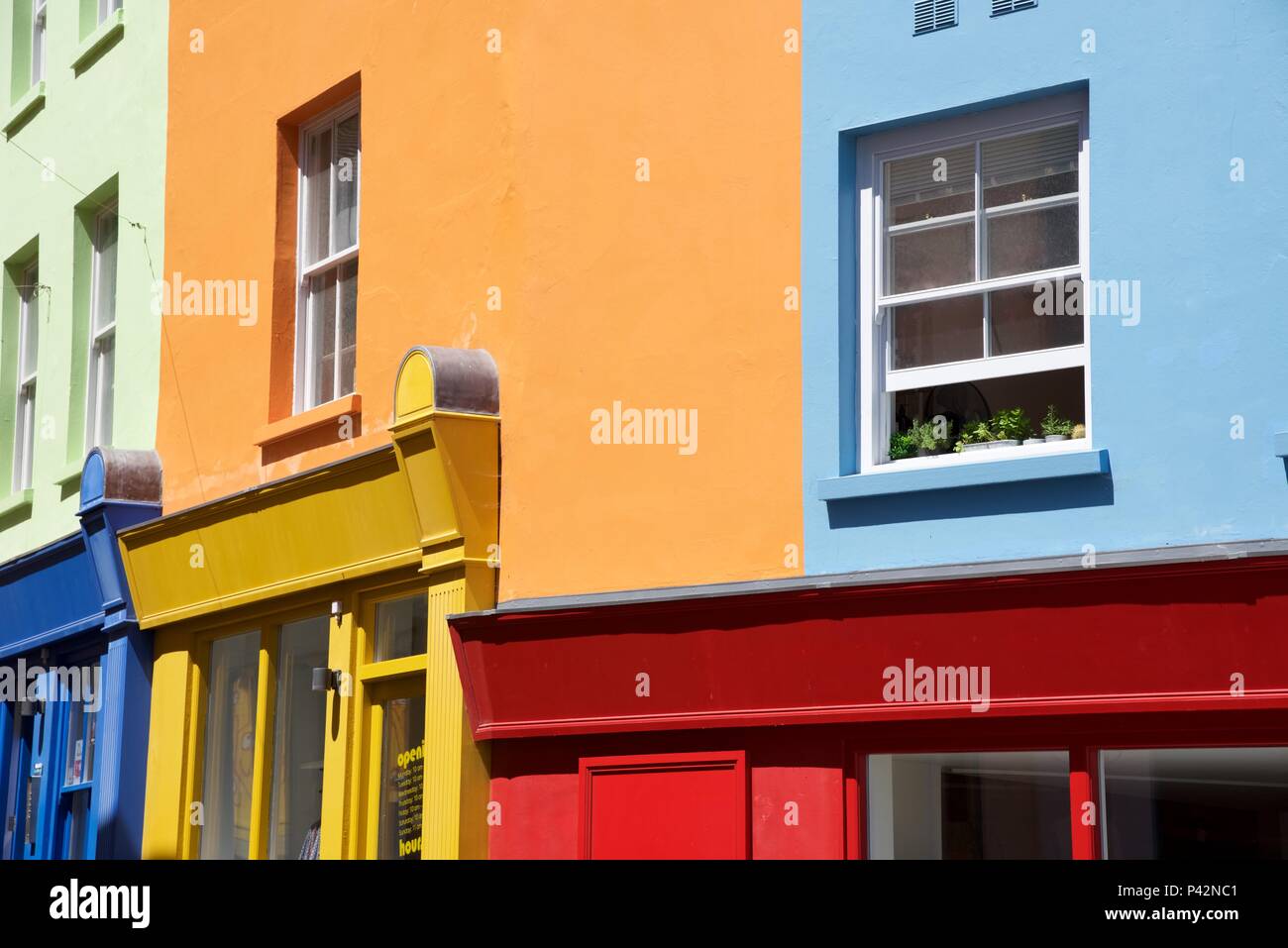 Colourful painted shop fronts hi-res stock photography and images - Alamy