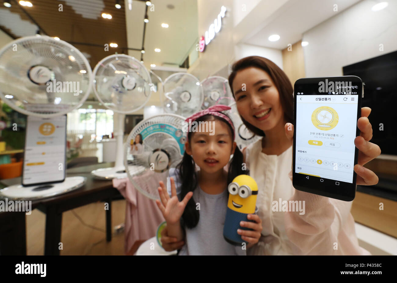 21st June, 2018. IoT fan Models pose with LG Uplus Corp.'s IoT fan ...