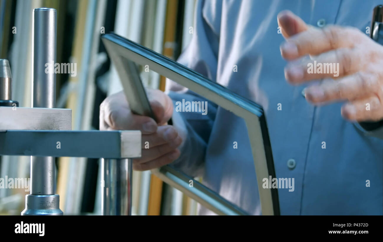 Professional framer hand holding frame angle Stock Photo - Alamy