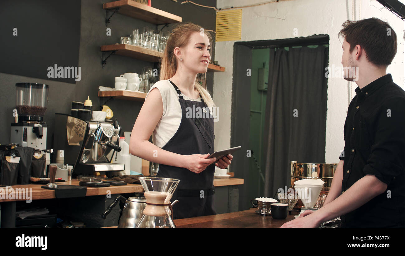 Male customer asking barista to make coffee in cafeteria Stock Photo ...