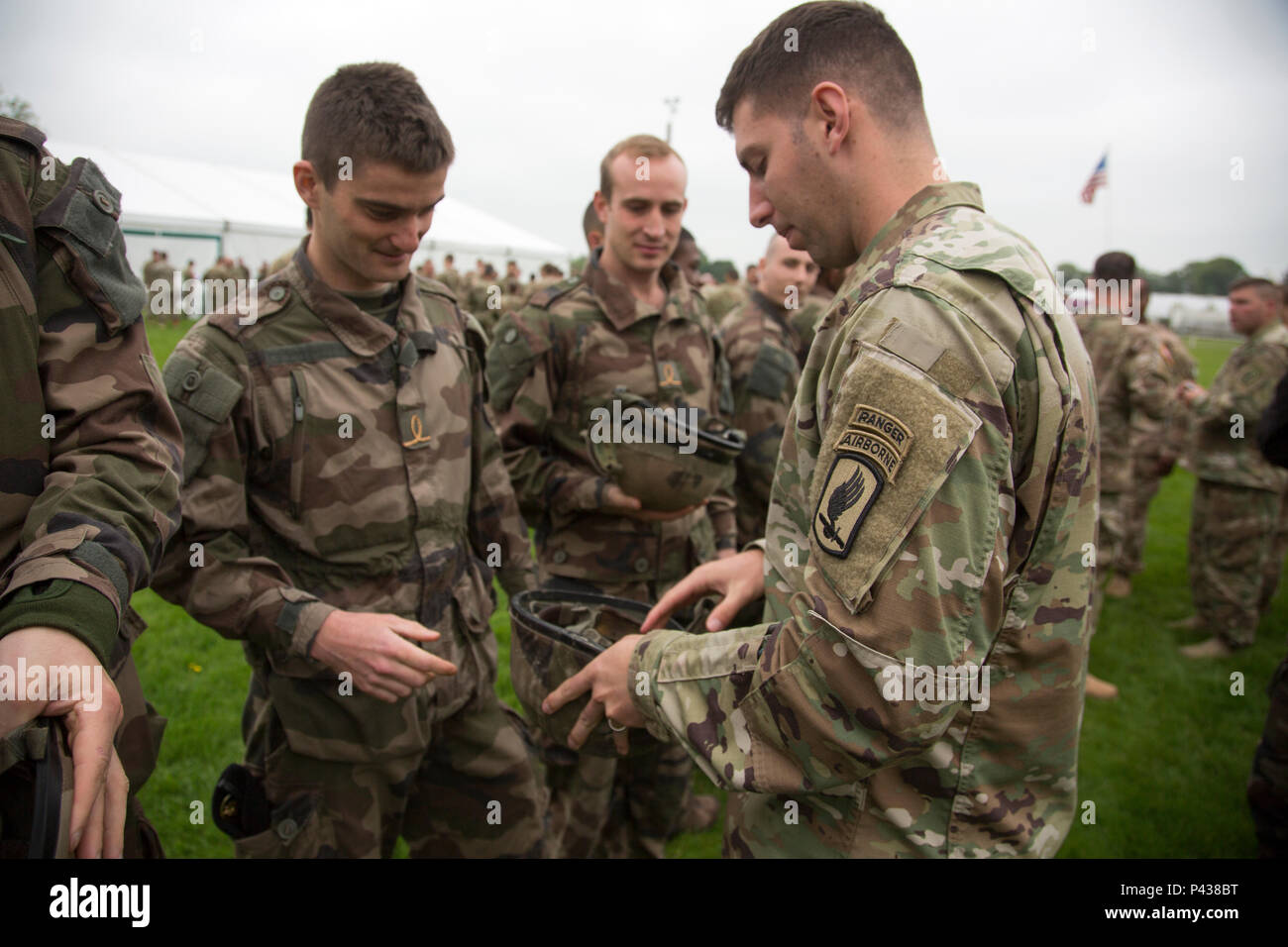 A U.S. Army jumpmaster checks equipment French paratroopers will use ...