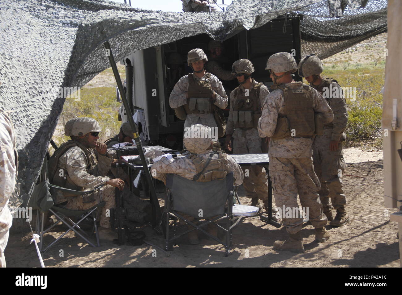Marines assigned to 2nd Battalion, 14th Marine Regiment discuss the day ...