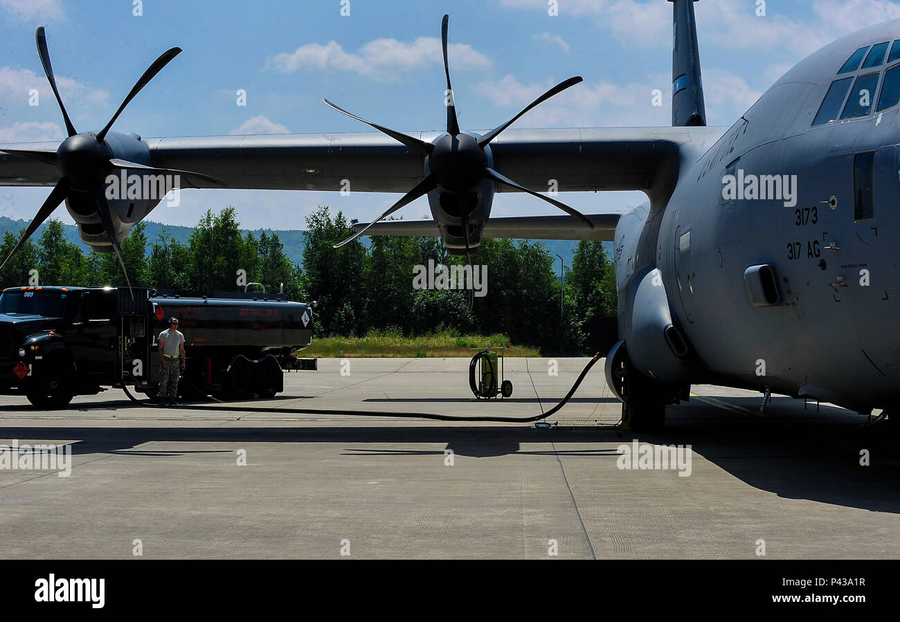 An Airman from the 86th Logistics Readiness Squadron fuels a C-130J ...