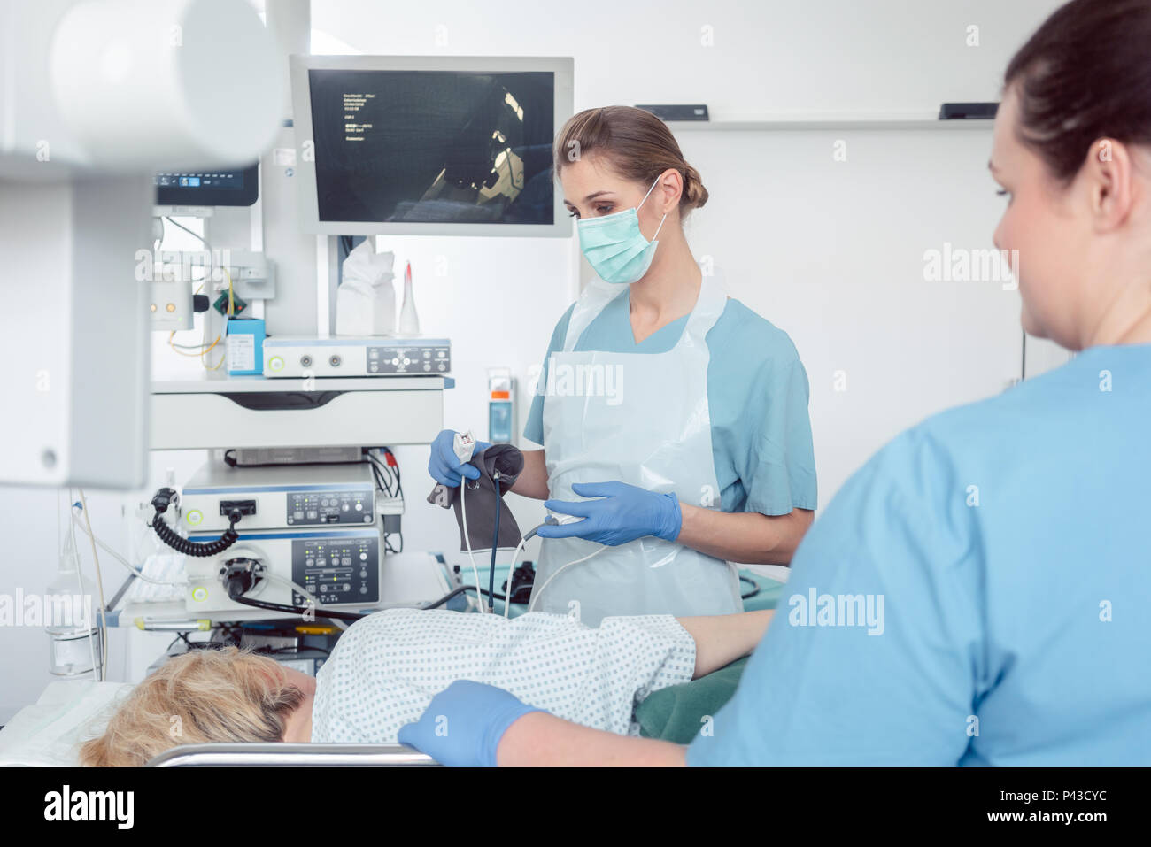 Internist doctors during stomach examination Stock Photo - Alamy