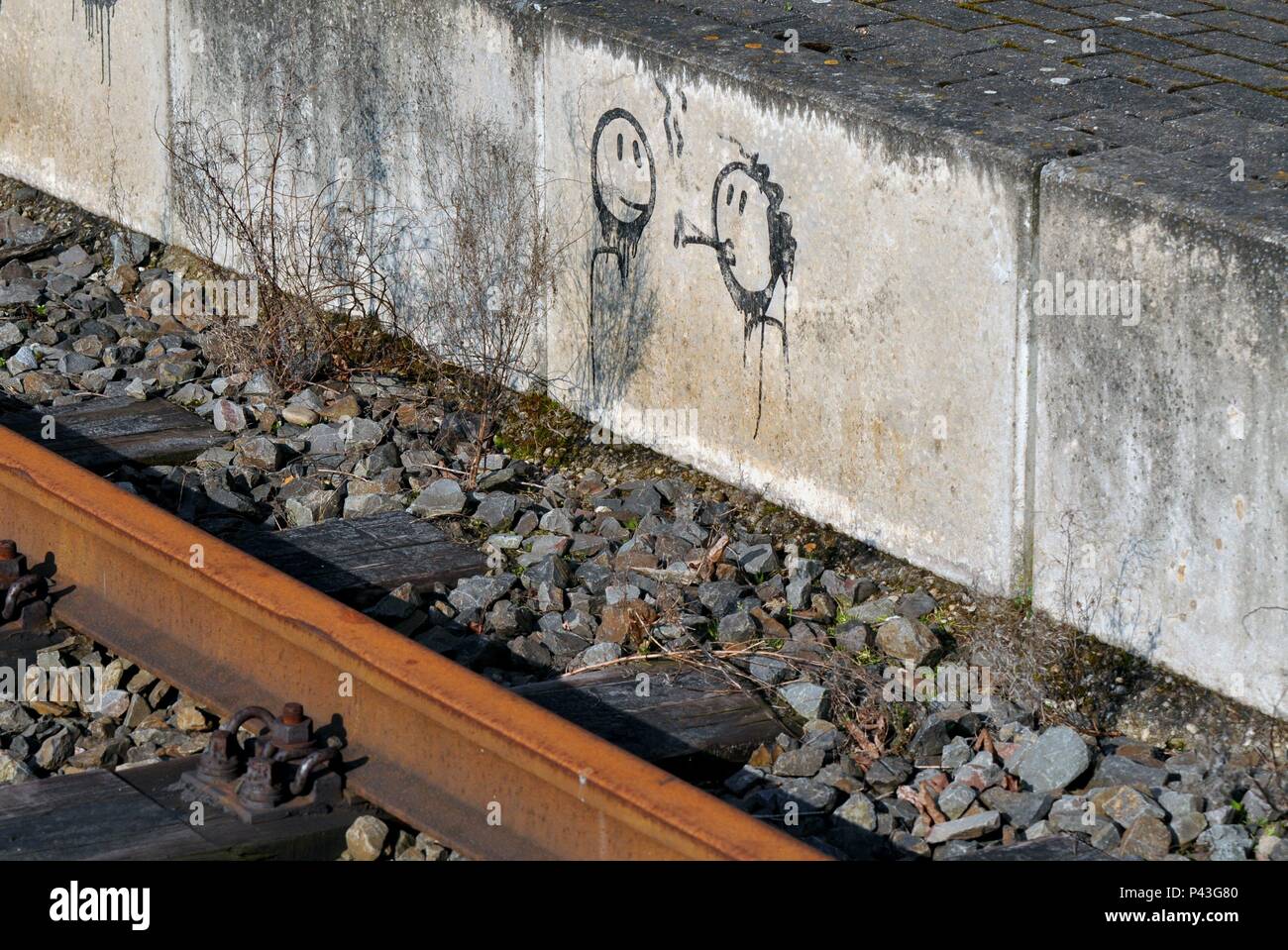 Graffiti with two faces on Platform on 09.04.2016 in Oberhausen ...