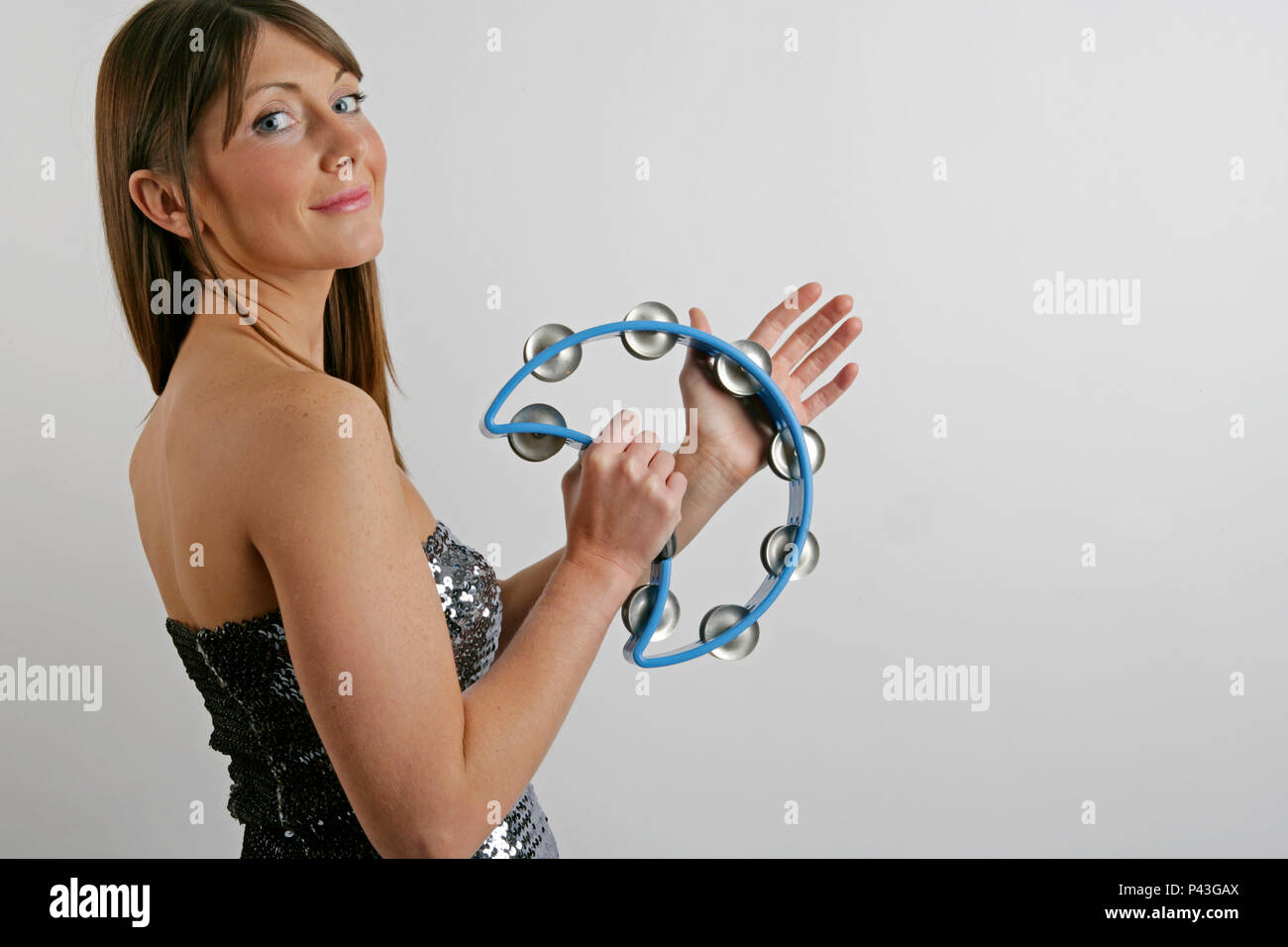 Playing tambourine hi-res stock photography and images - Alamy