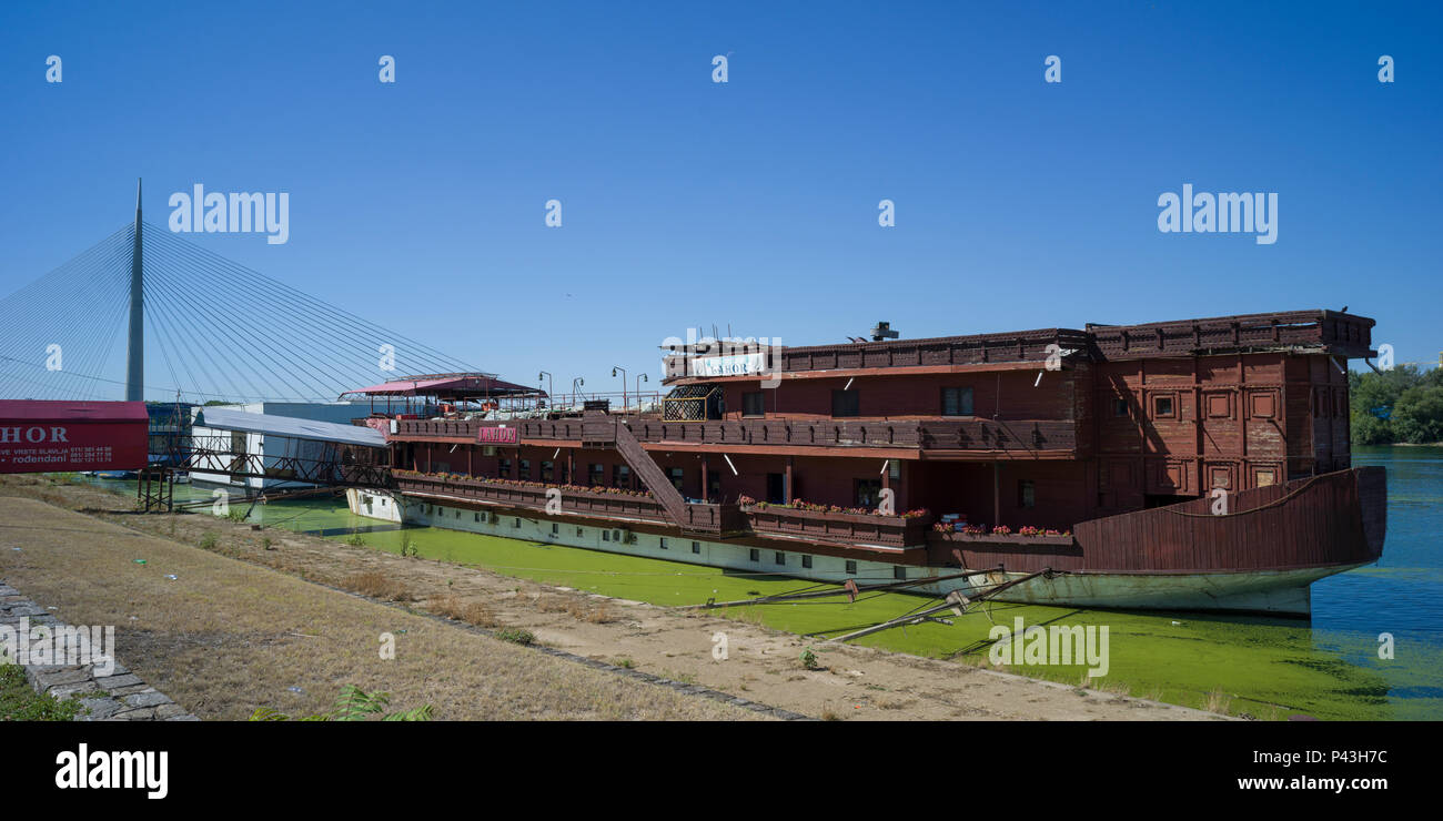 Barge in the Sava River with Ada Bridge in the background, Belgrade ...