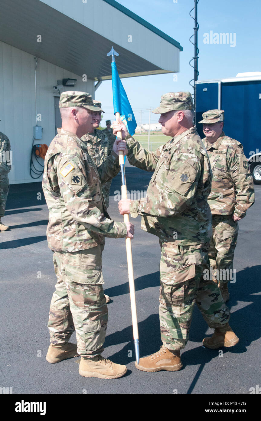 Maj. Gregory Farr, of Choctaw, Oklahoma, receives the unit colors from ...