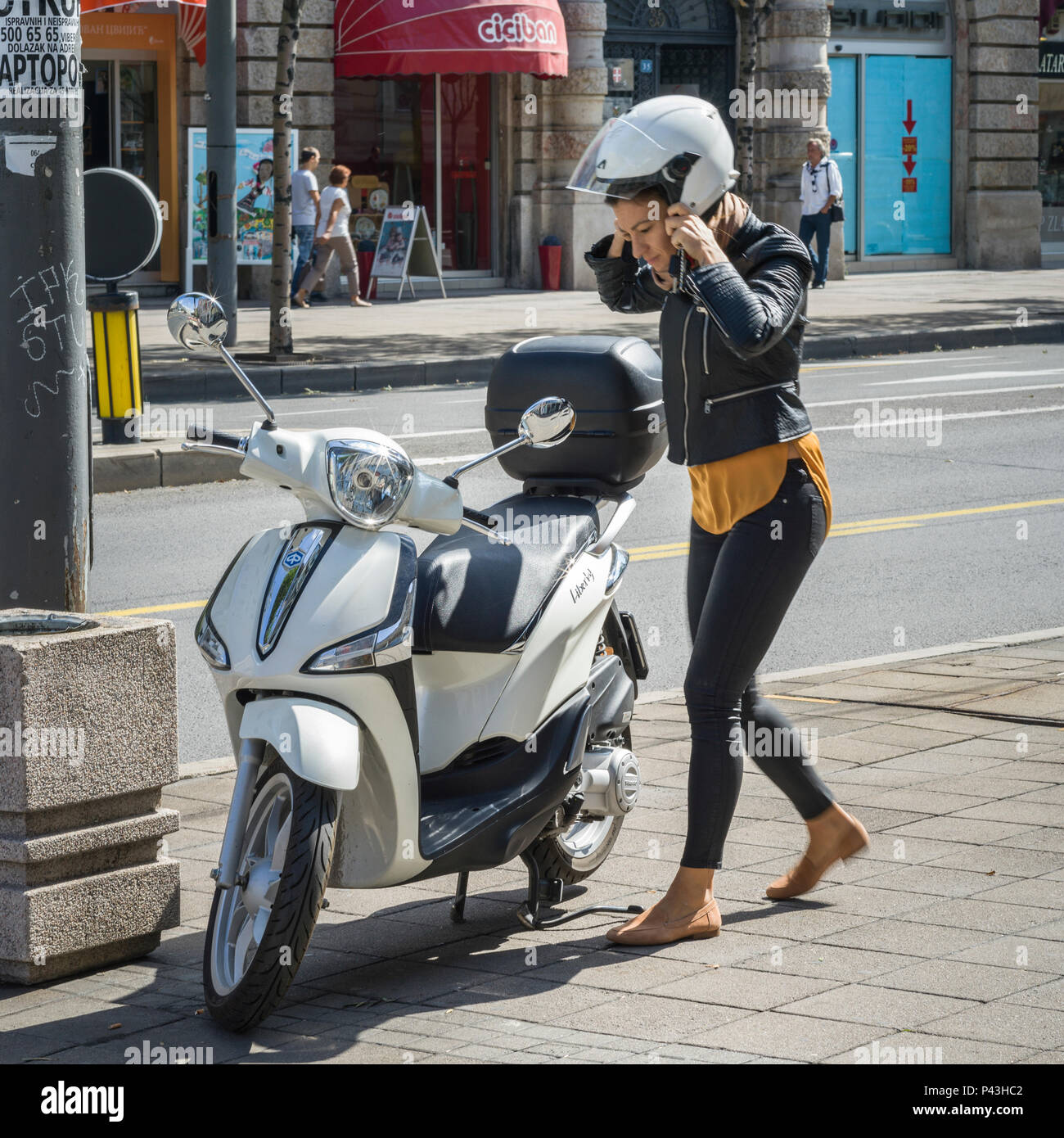 Person motorbike putting on helmet hi-res stock photography and images ...
