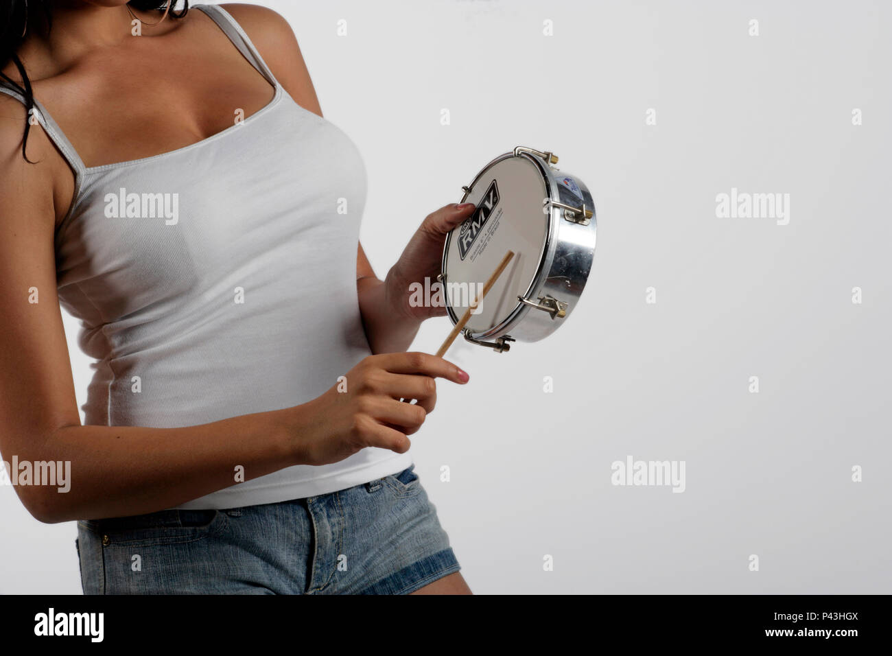 Brazilian woman playing the Tamborim, latin american percussion ...