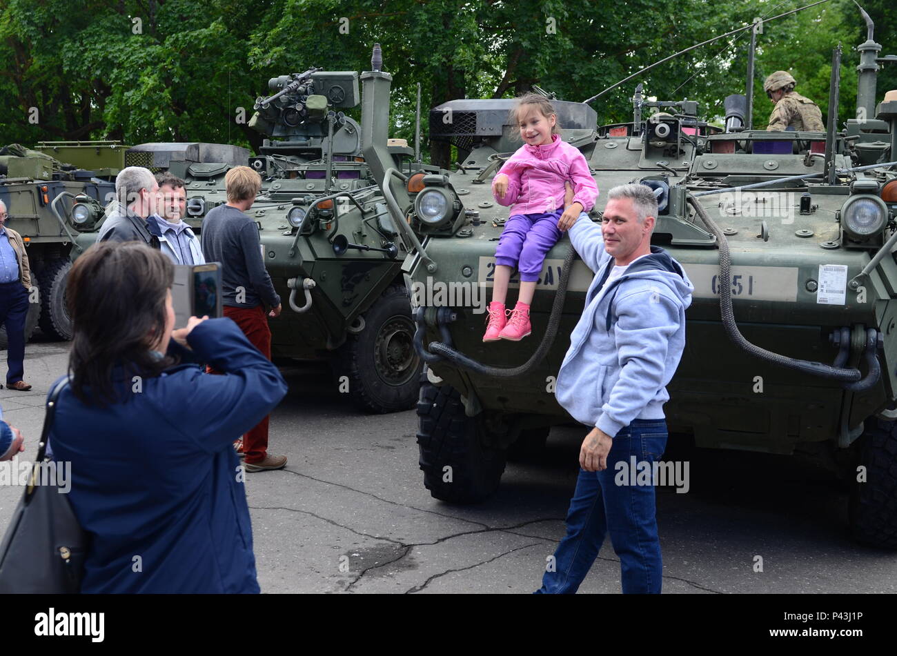 Residents of Birzai, Lithuania pose for a photograph in front of an ...