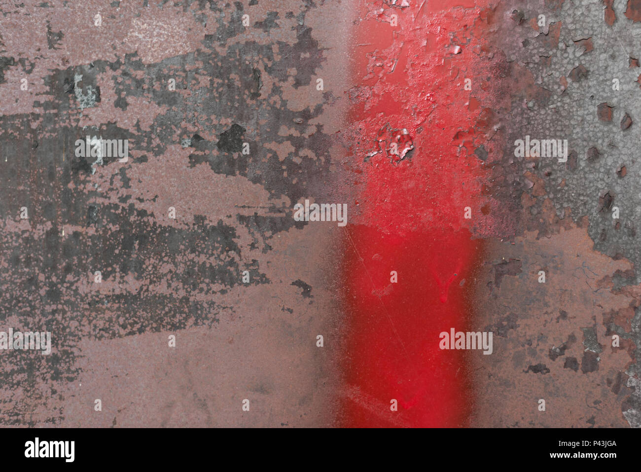 Graffiti detail on old building facade. Red painted line on a wall ...